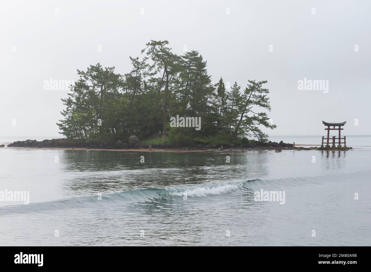 The torii gate and shrine island of Benten-jima, off the coast of Noto ...