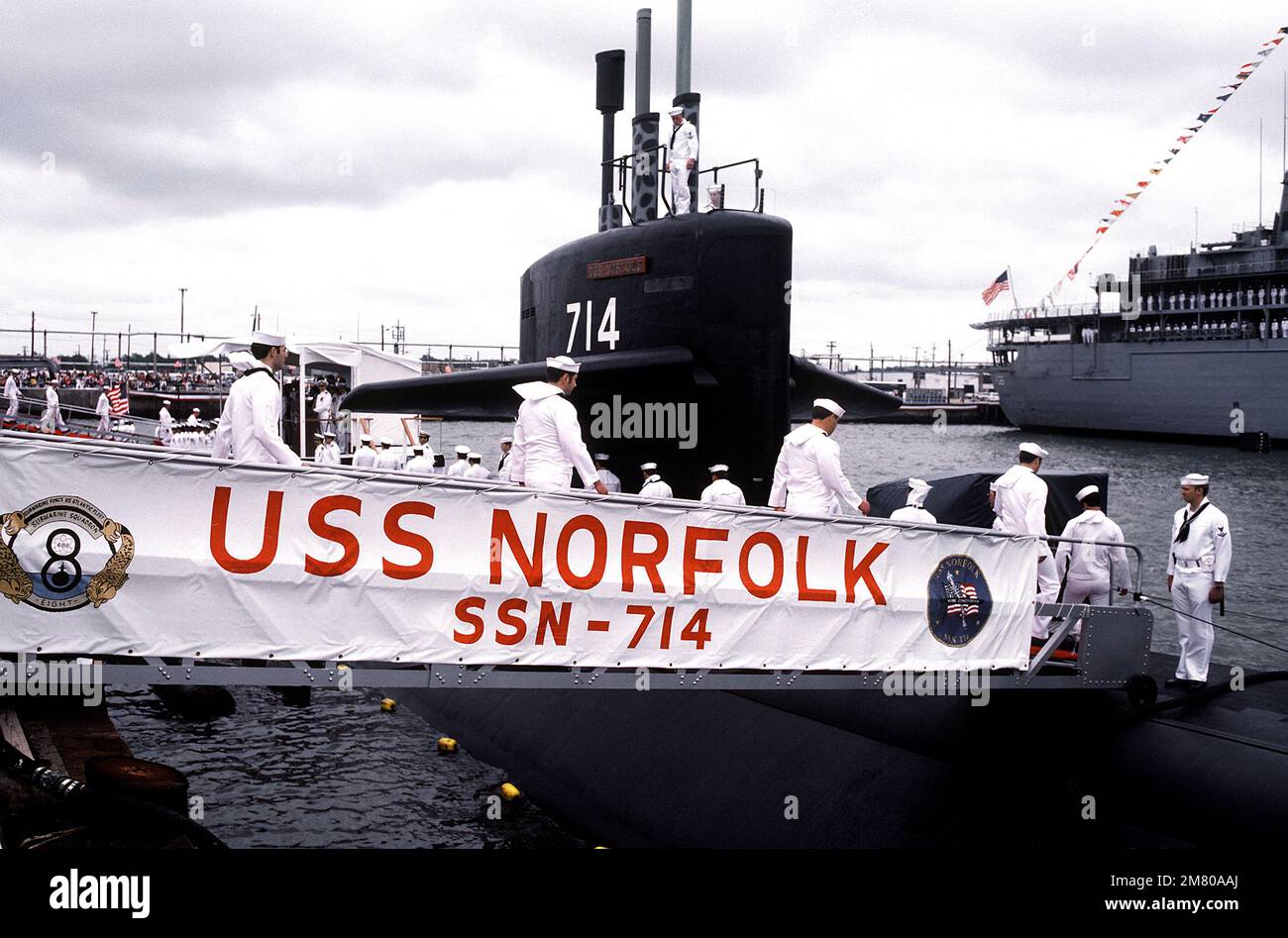 Crew members go aboard the nuclear-powered attack submarine USS NORFOLK ...