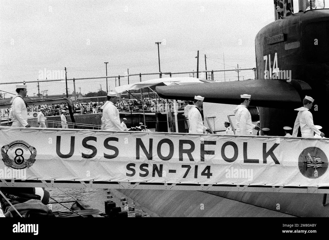 Crewmen prepare to set the watch at the conclusion of the commissioning ...