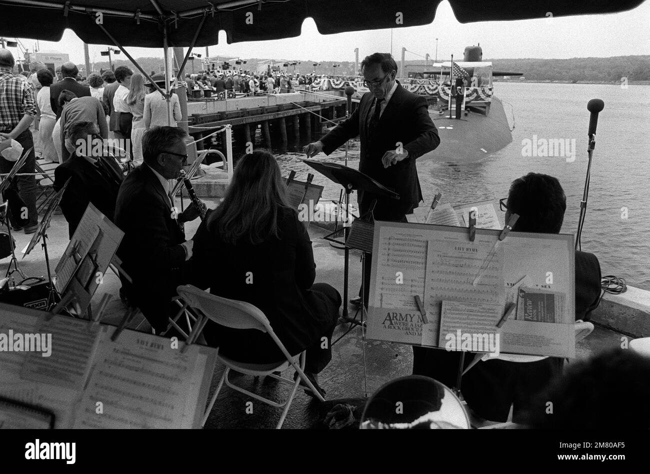A band plays during commissioning ceremonies for the nuclear-powered ...