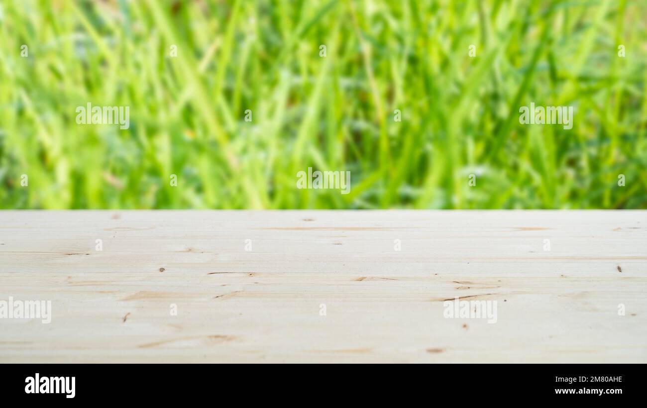 A light wooden tabletop with copy space for installing a product or ...