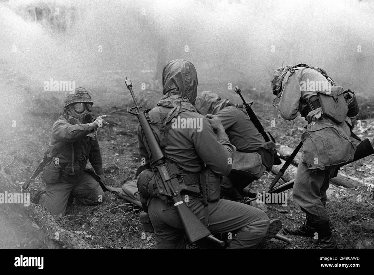 Members of the 36th Medical Battalion, armed with M-16A1 rifles, don ...