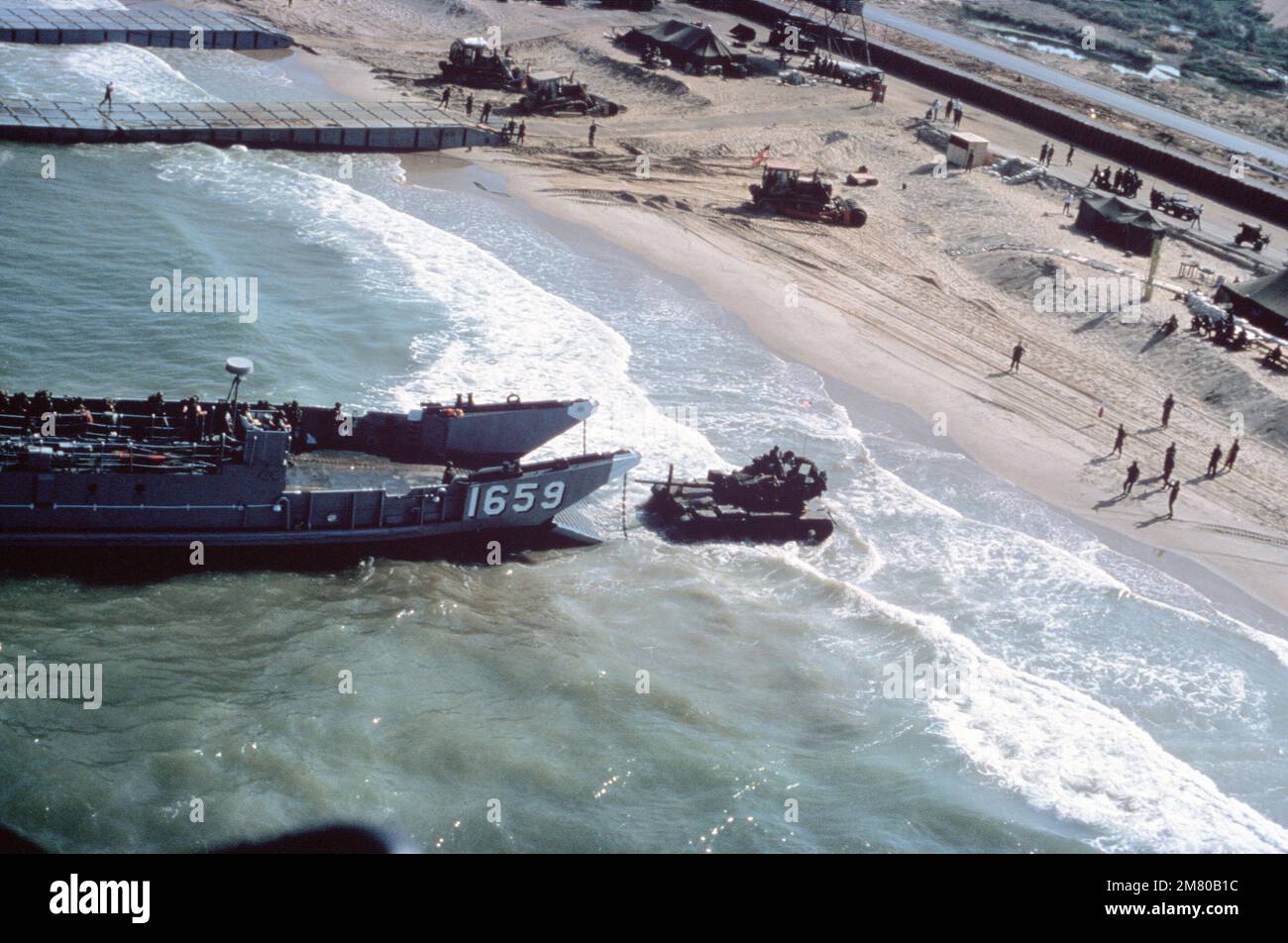 An aerial view of a Marine M60 tank as it disembarks a utility landing ...