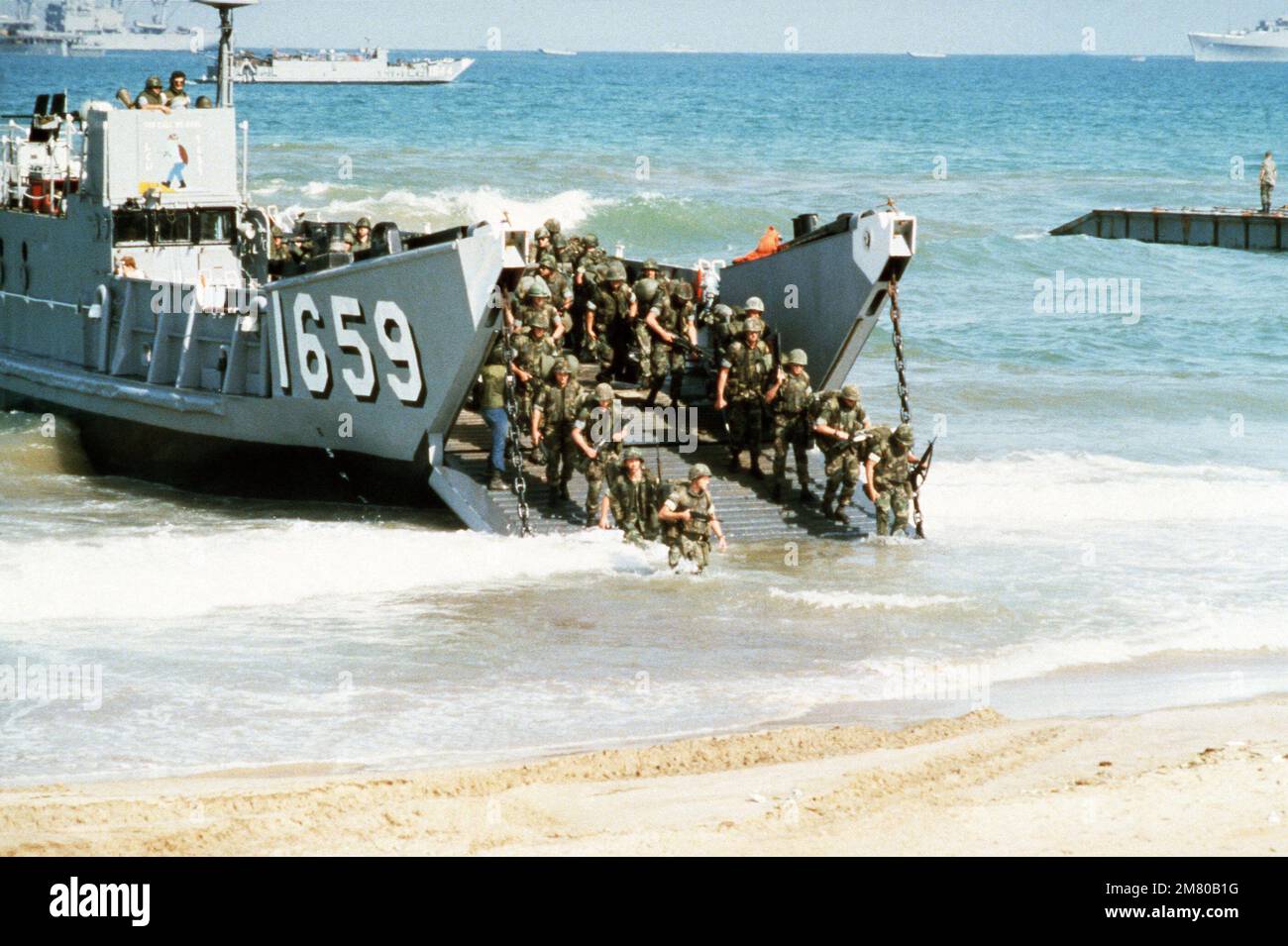 Marines disembark a utility landing craft (LCU) to participate as ...