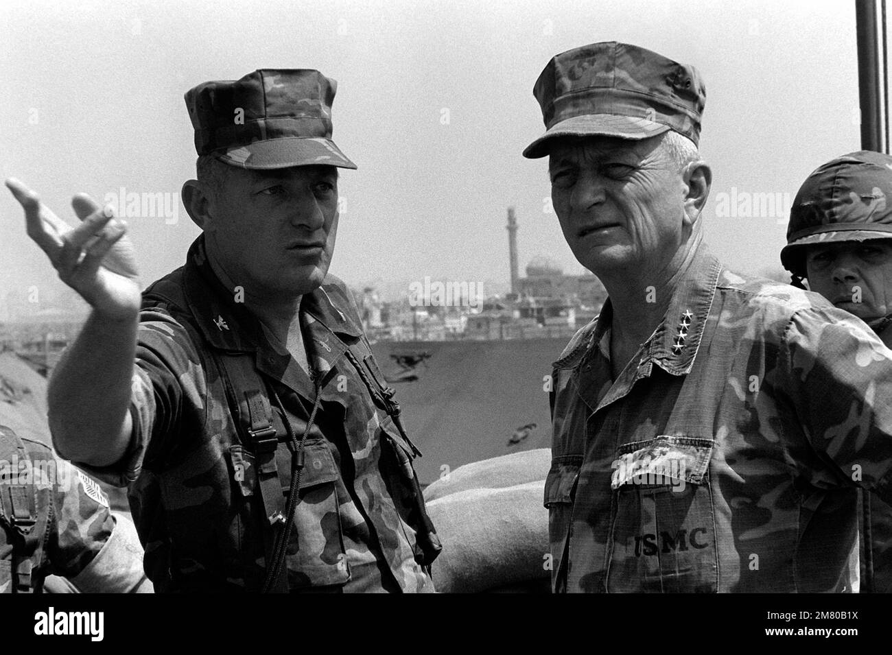 GEN Robert H. Barrow, commandant of the Marine Corps, speaks with COL ...