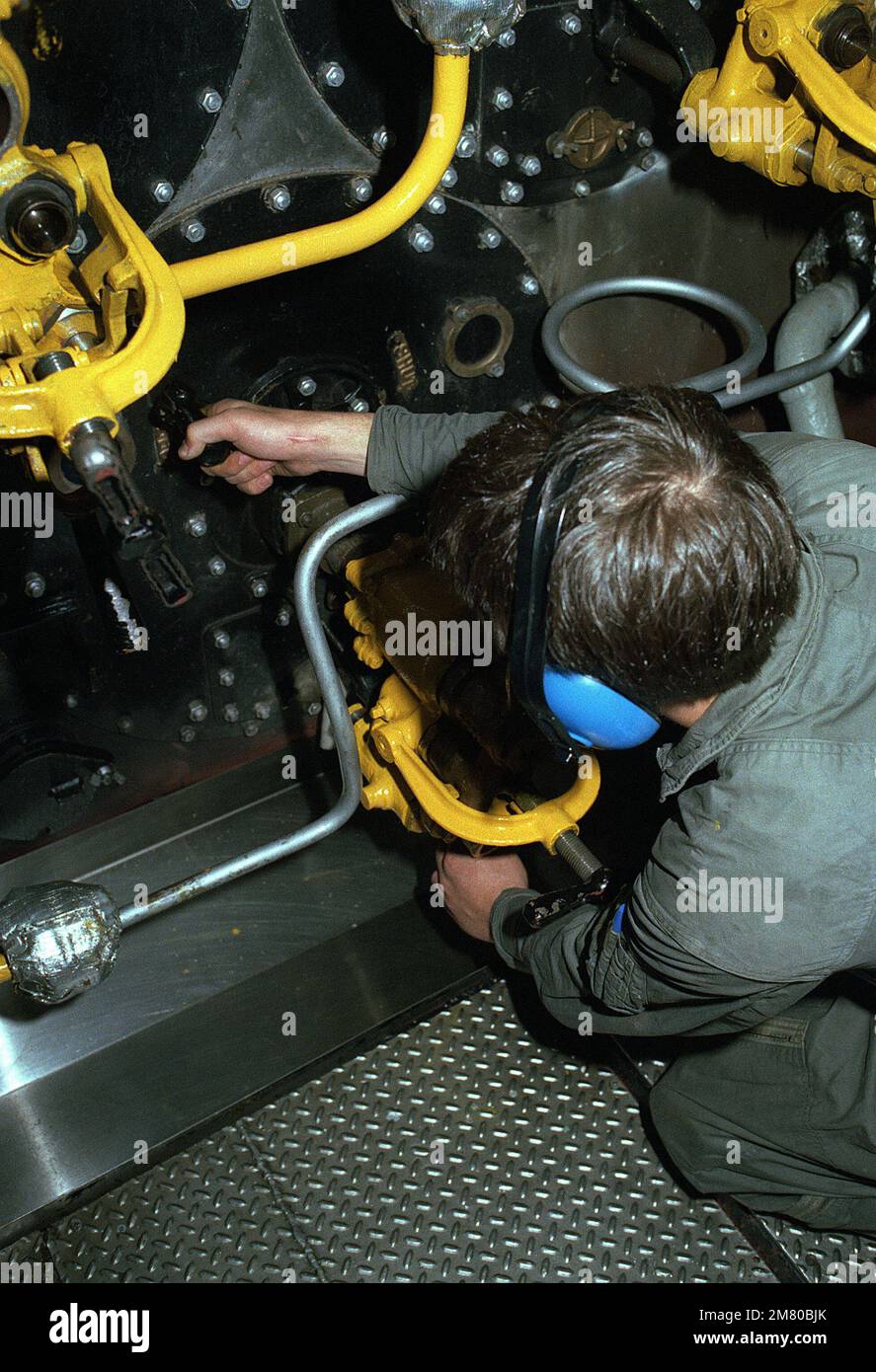 A boilerman technician lights the fire in a boiler of the No. 4 main ...