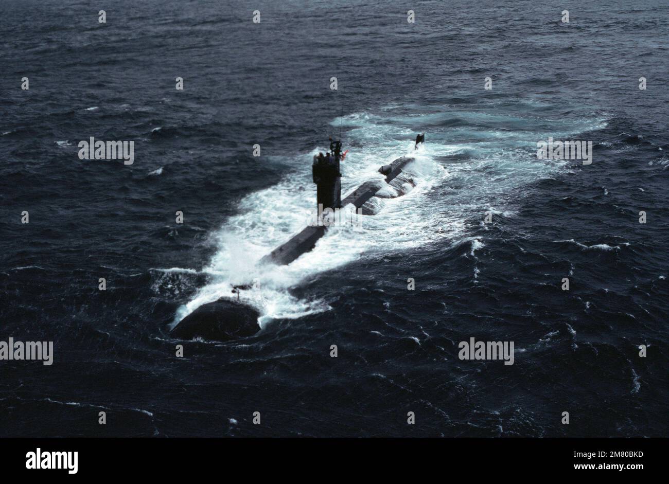 An aerial port bow view of the submarine USS DOLPHIN (AGSS 555 ...