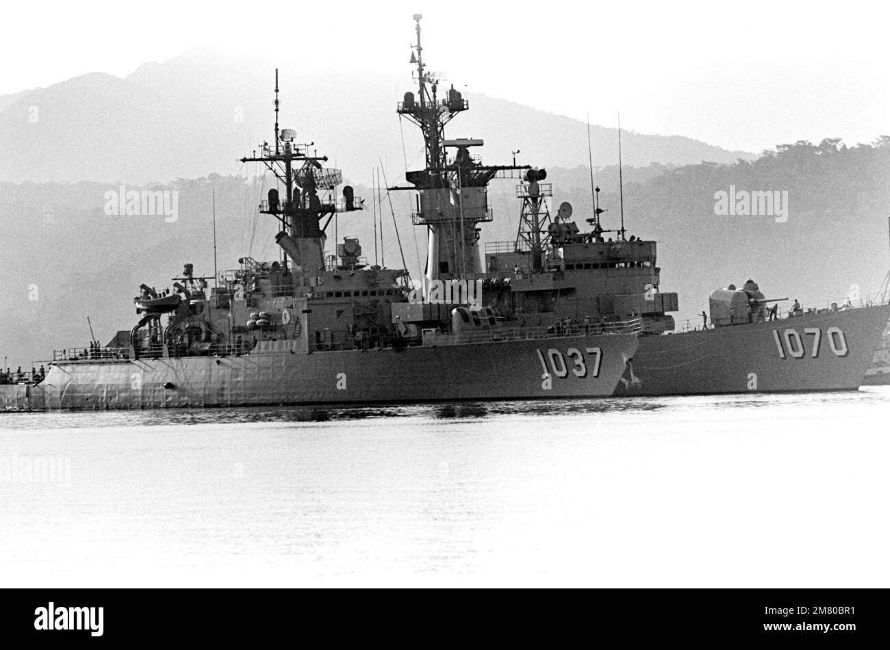 A starboard bow view of the frigates USS DOWNES (FF 1070) and USS ...