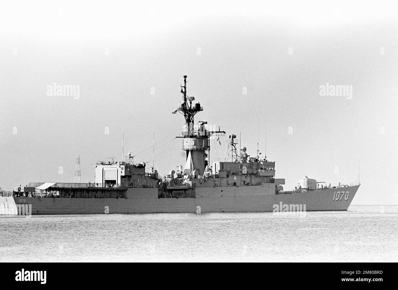 A starboard quarter view of the frigate USS DOWNES (FF 1070) leaving US ...