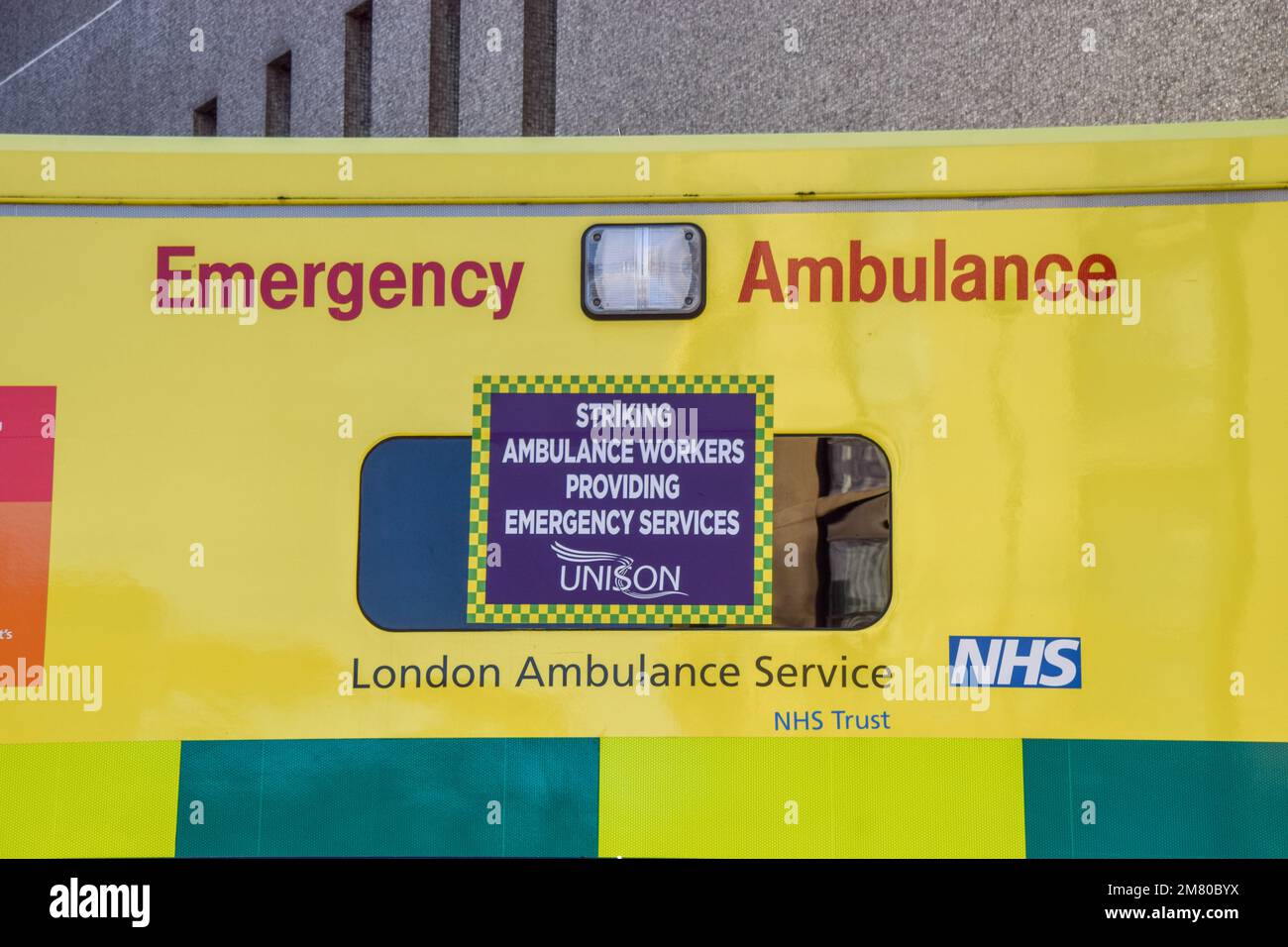 A strike placard is seen on an ambulance at the Unison (trade union ...