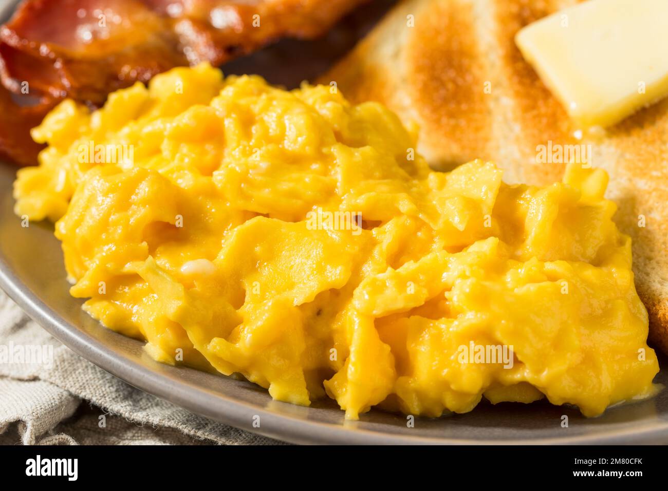 Homemade American Scrambled Egg Breakfast with Bacon and Toast Stock Photo - Alamy