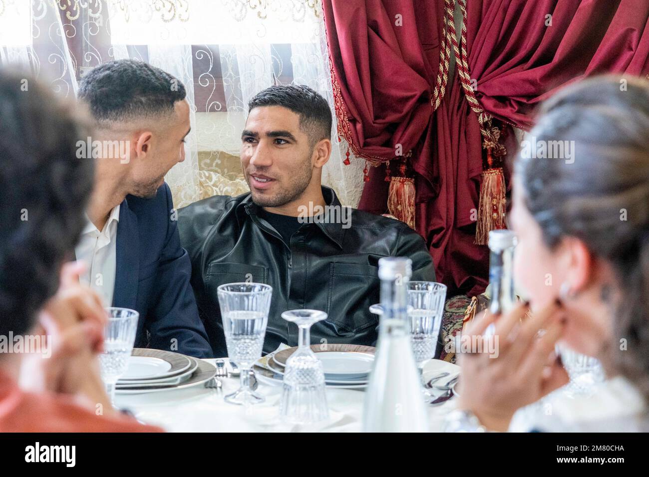 Morocco's Achraf Hakimi looks on during a visit to his family's ...