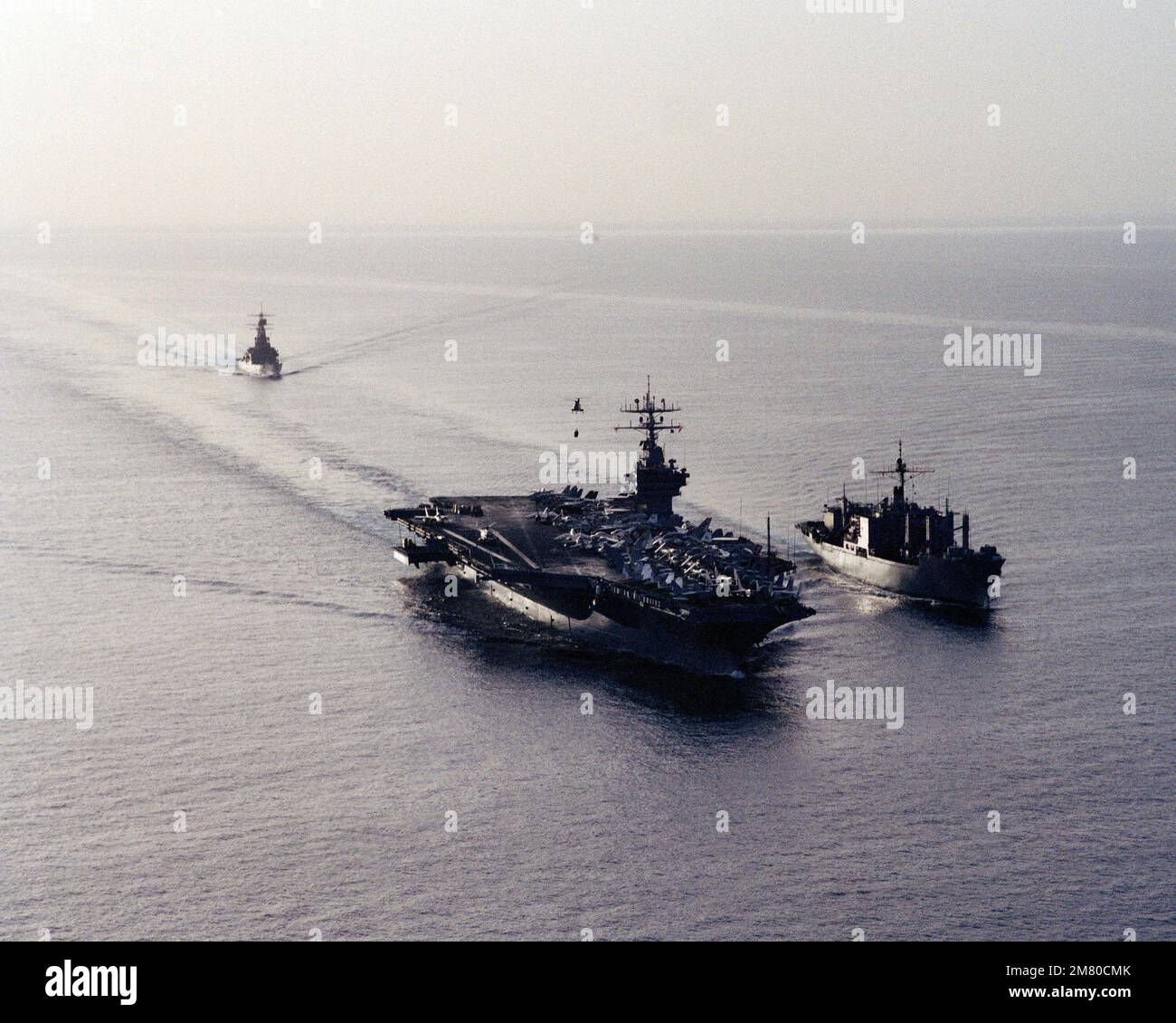 The nuclear-powered aircraft carrier USS CARL VINSON (CVN 70), right ...