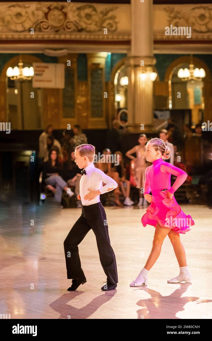 Attractive young couple of children dancing ballroom dance. Girl and ...