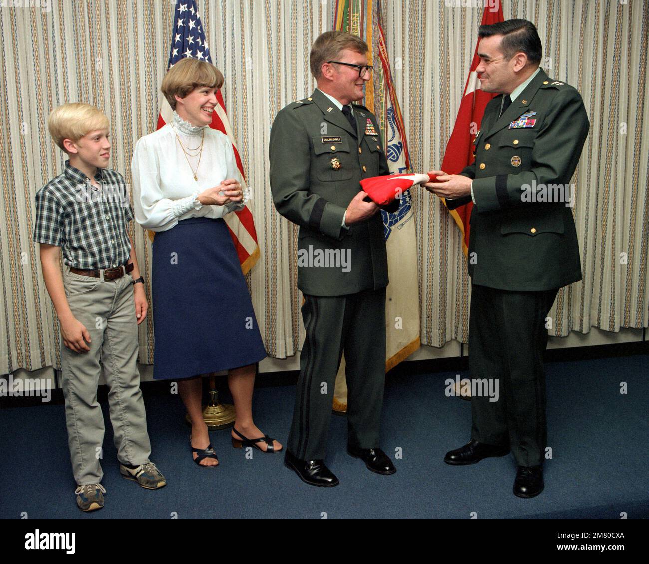 Brig. GEN. John M.D. Shalikashvili receives a flag indicating his new ...