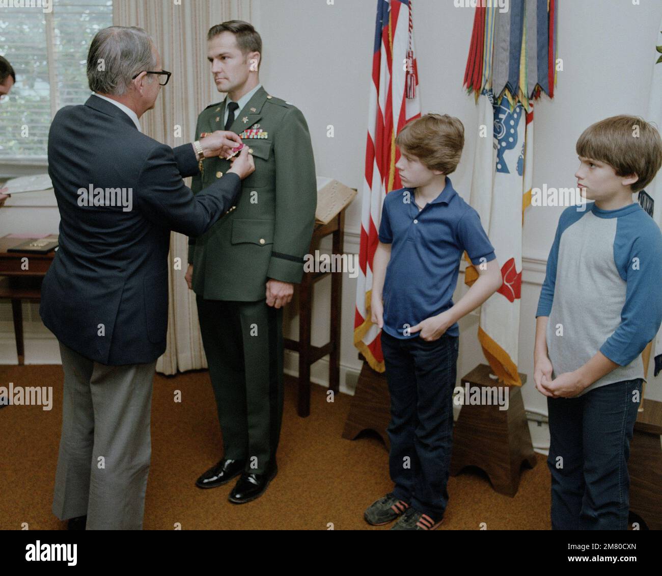 Acting Assistant Secretary of the Army William D. Clark presents the ...