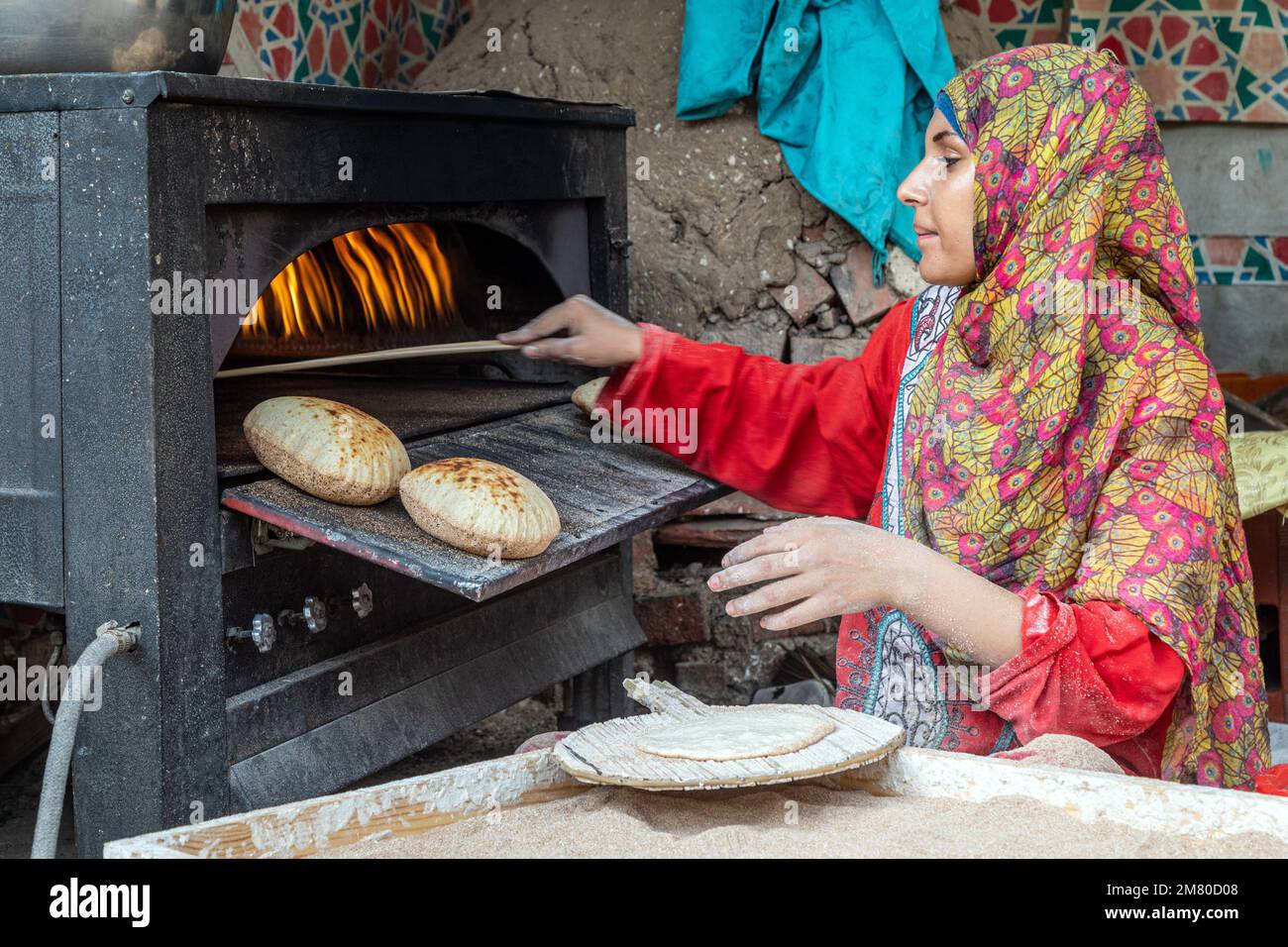 ARAB WOMAN MAKING THE TRADITIONAL BALADI BREAD, SAQQARA NECROPOLIS FROM ...