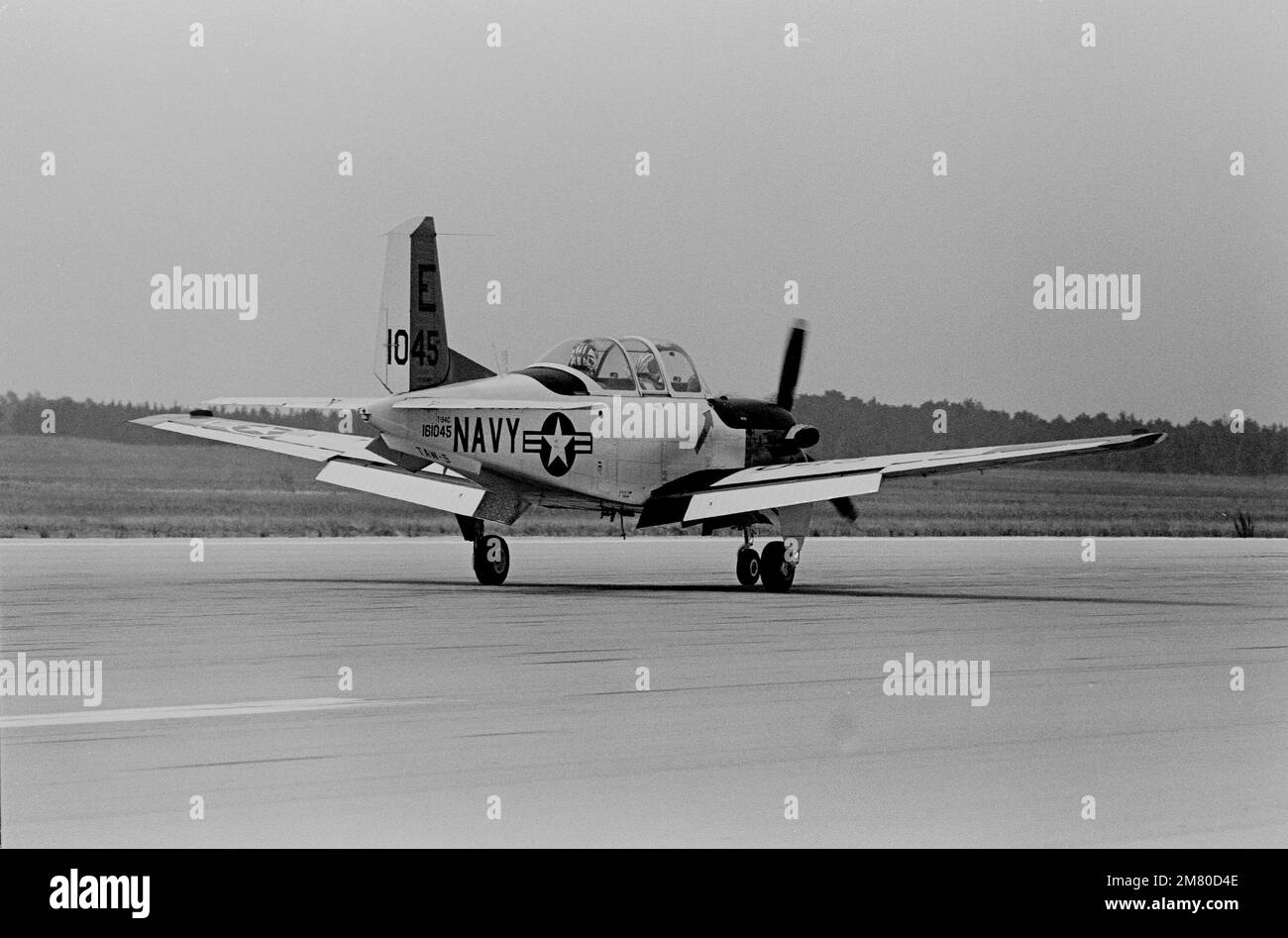 A right rear view of a T-34C Mentor trainer aircraft parked on the ...