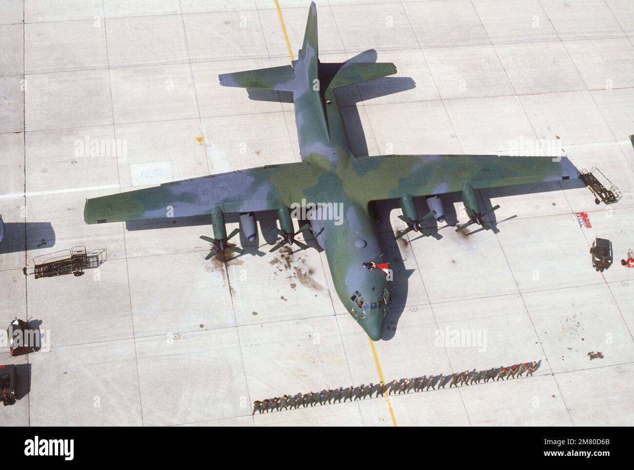 An aerial view of camouflaged C-130 Hercules aircraft as the opening ...