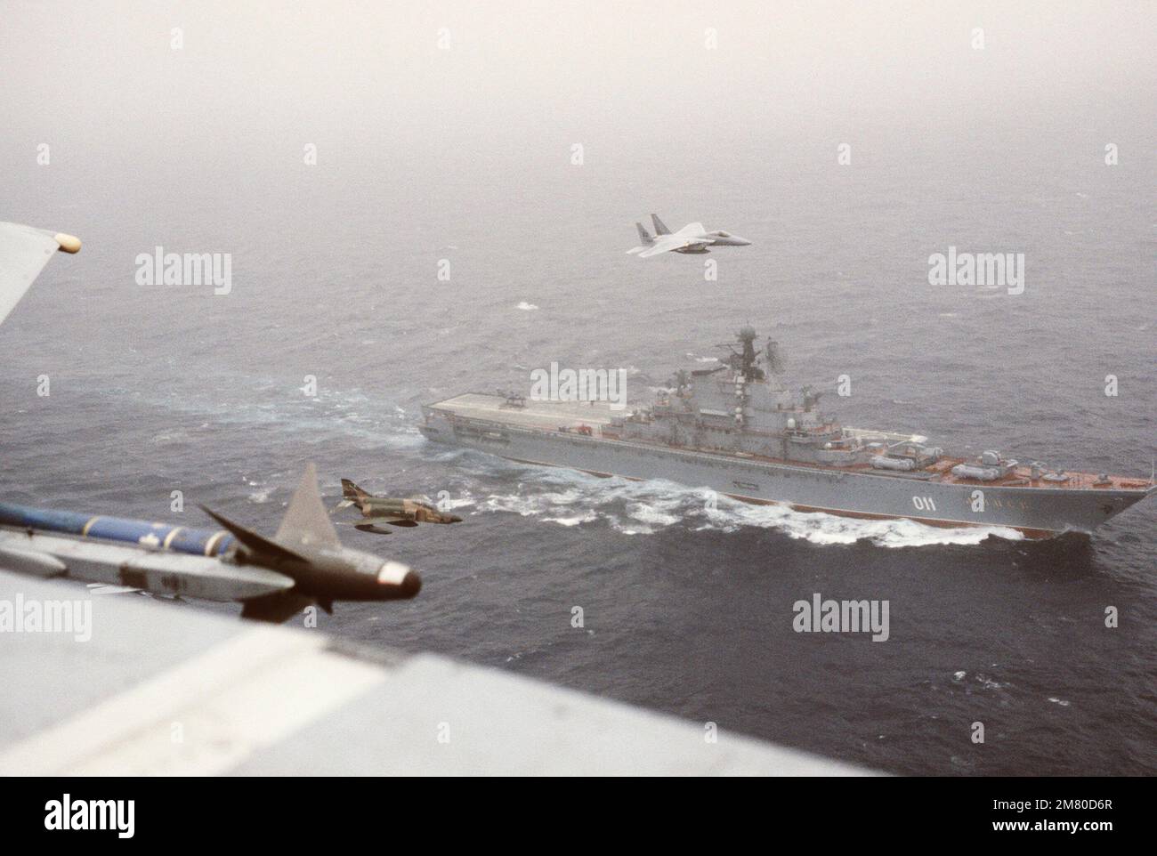 An aerial view of the Soviet aircraft carrier MINSK as an F-15 Eagle ...
