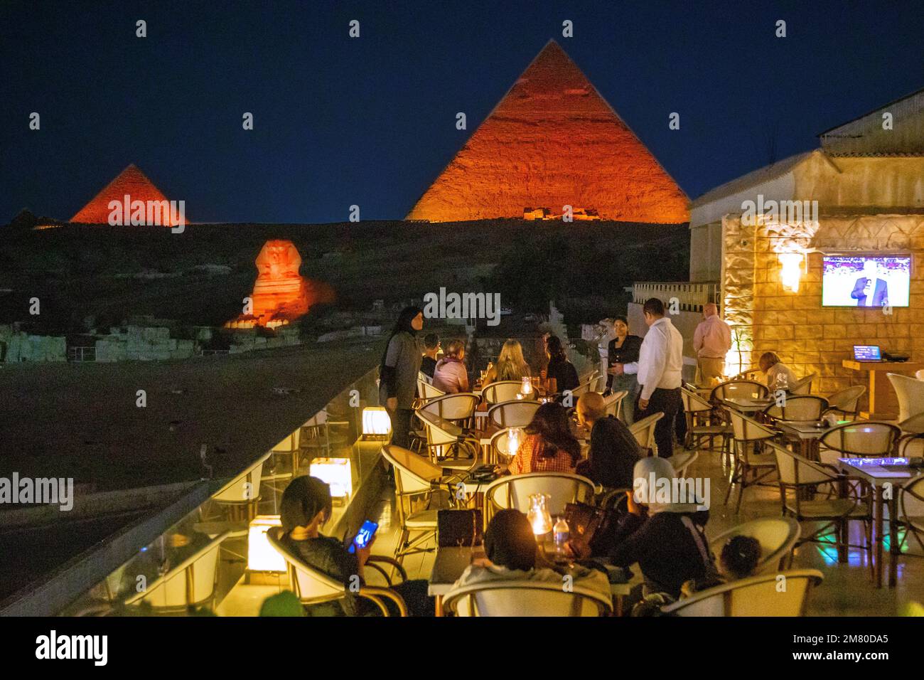 OUTDOOR CAFE AT NIGHTFALL FOR THE SOUND AND LIGHT SHOW ON THE PYRAMIDS ...