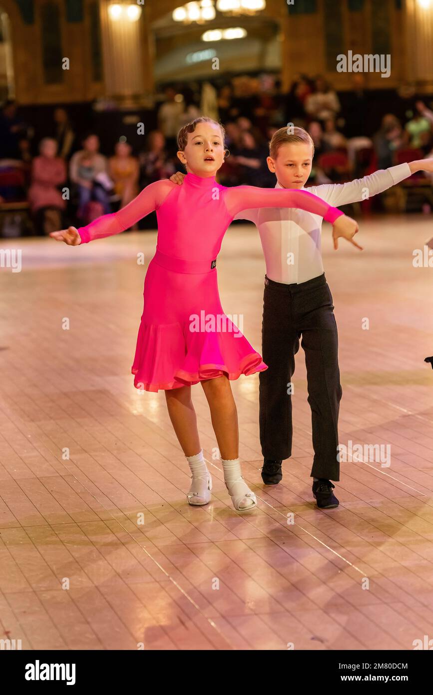 Attractive young couple of children dancing ballroom dance. Girl and ...