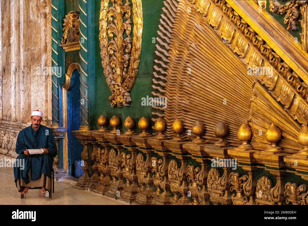 READING IN FRONT OF THE MINBAR OF SCULPTED AND GILDED CEDAR INSIDE THE ...