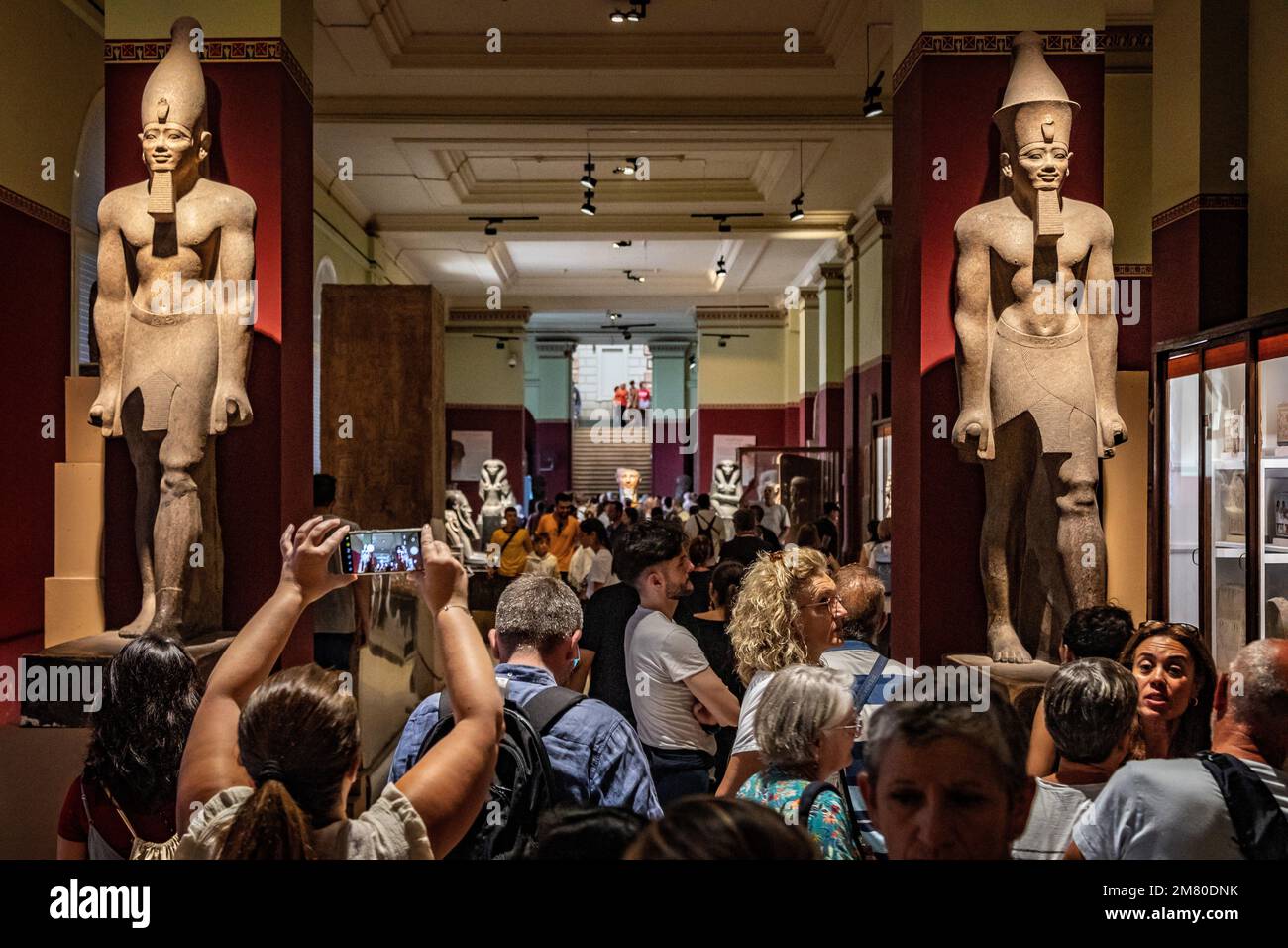 CROWD OF TOURISTS IN FRONT OF THE PINK GRANITE COLOSSUS OF KING ...