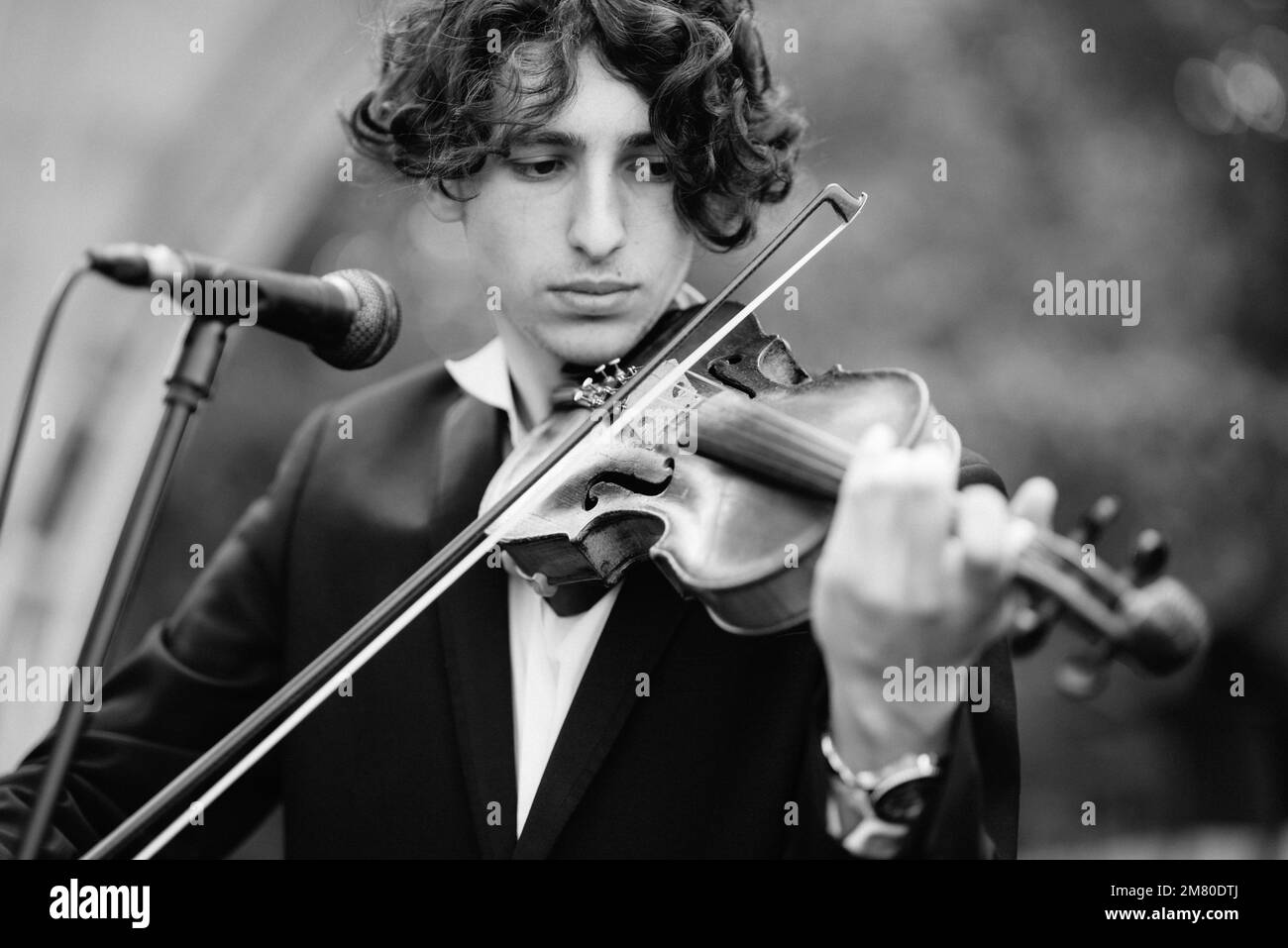 guy musician plays the drum at a concert in stage lighting Stock Photo ...