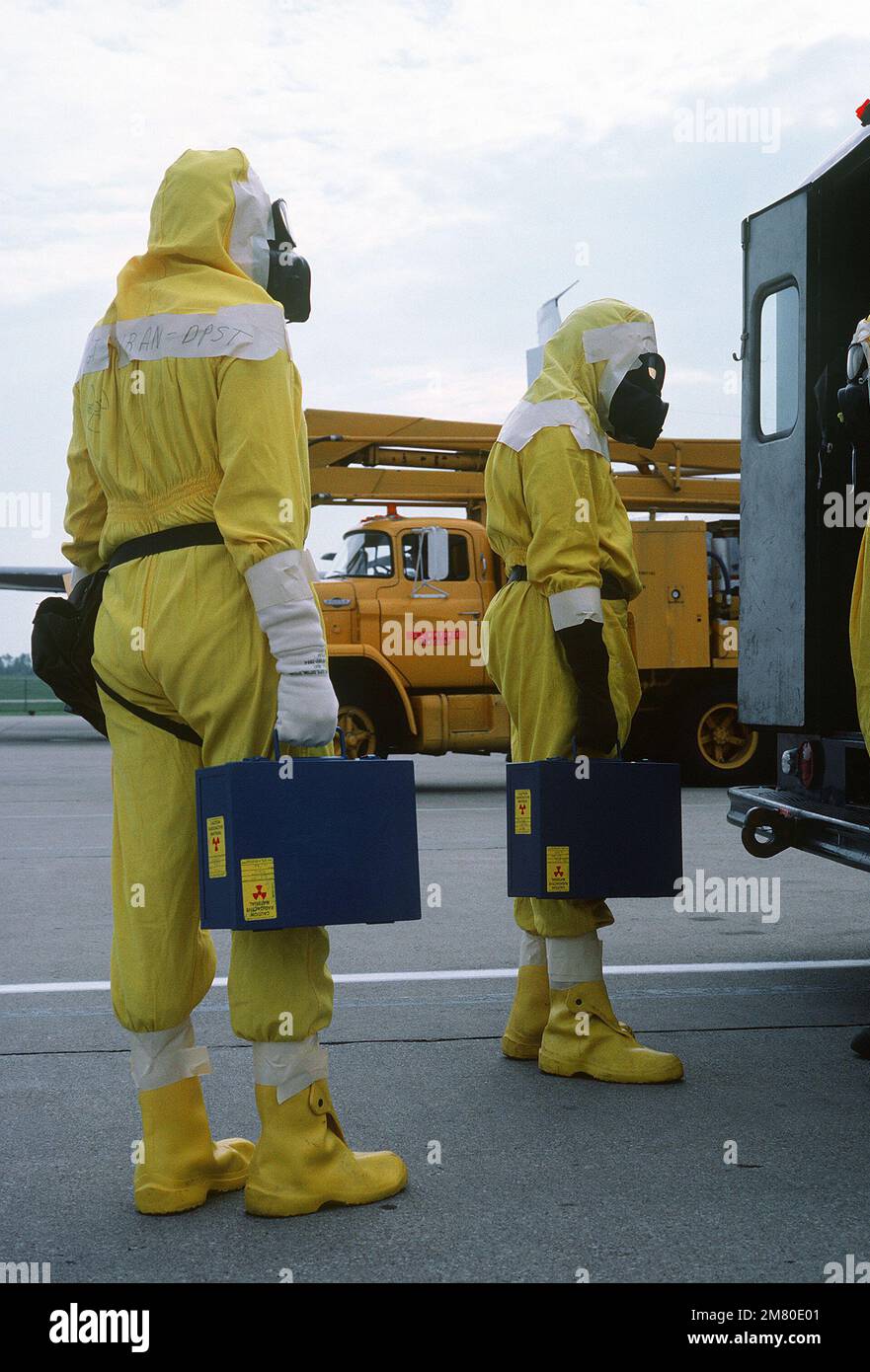 Members of the Disaster Response Force, wearing nuclear-biological ...