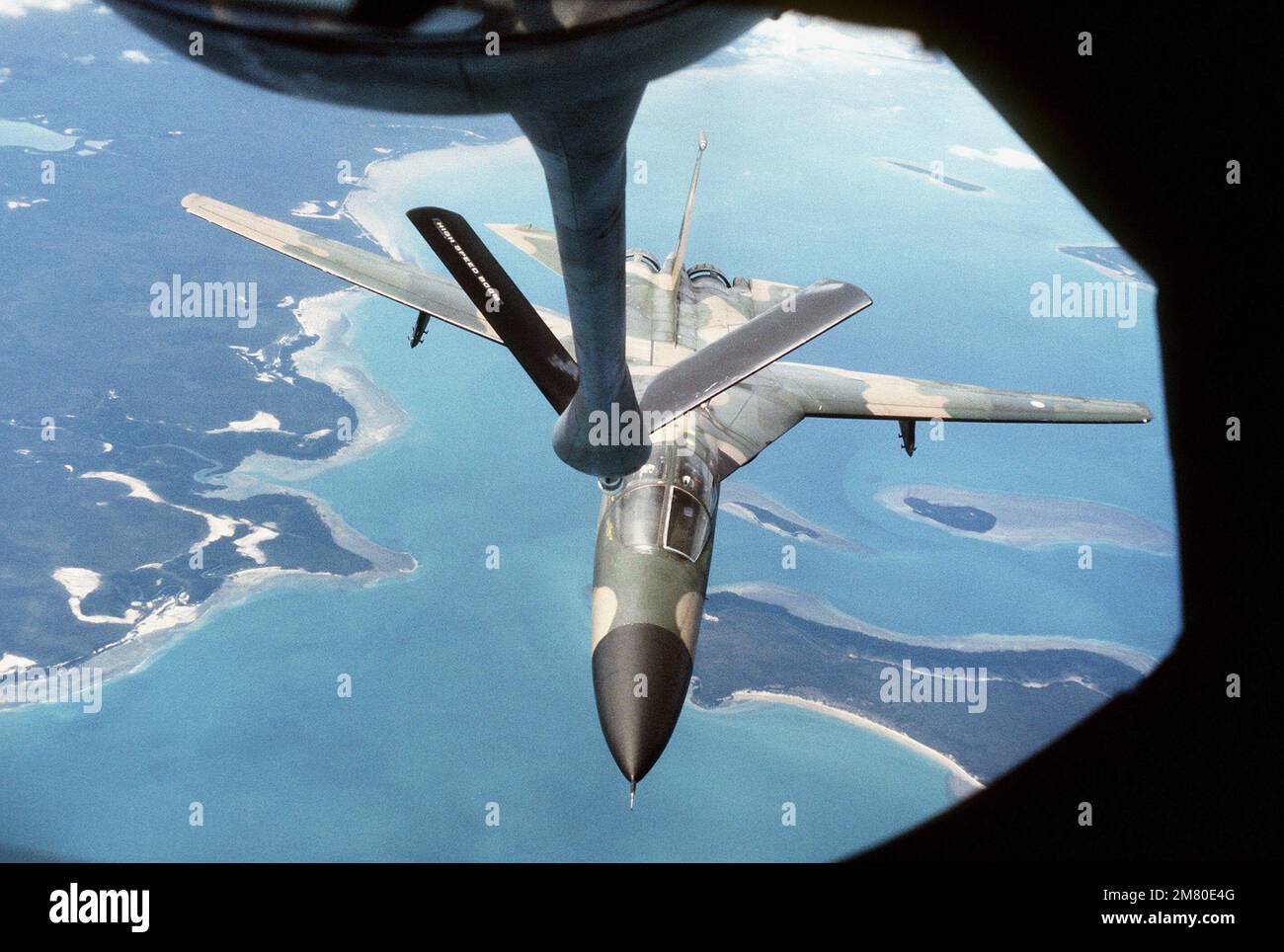 A view from a KC-135 Stratotanker aircraft boom operator's window of an F-111 aircraft as it ...