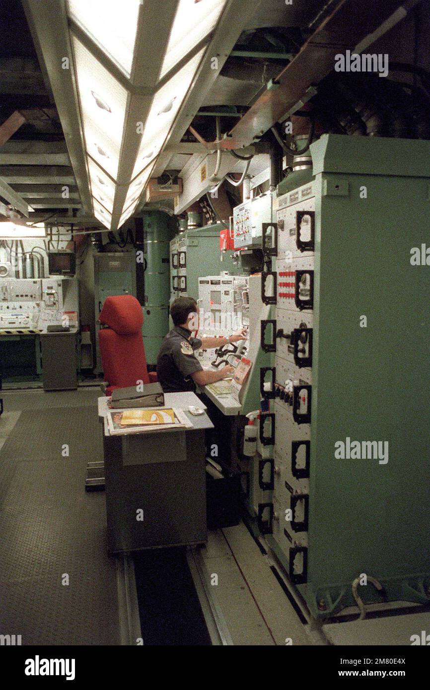 A member of the 321st Strategic Missile Wing works at a control panel ...