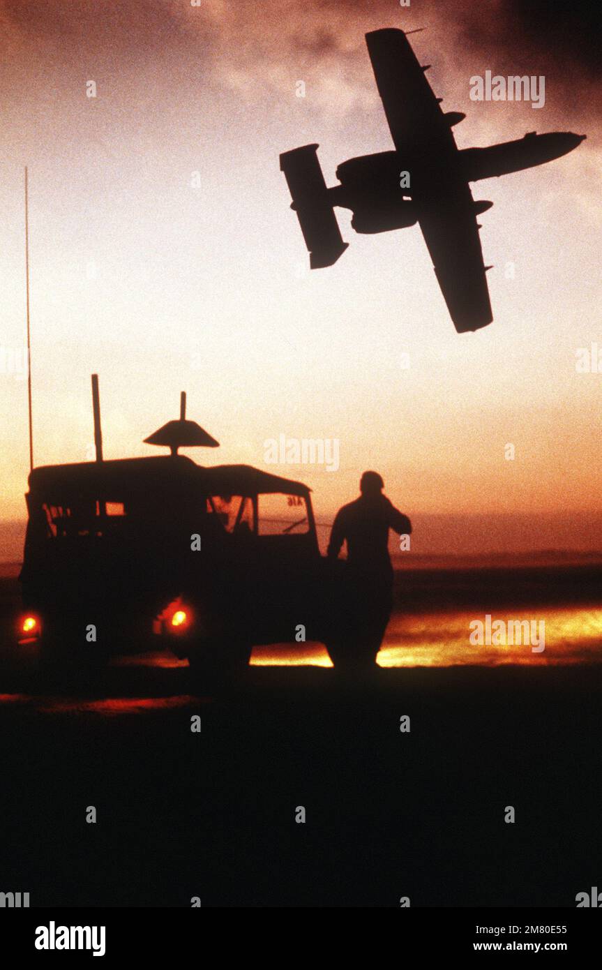 An Air Liaison Officer (ALO) watches as an A-10 Thunderbolt II aircraft ...