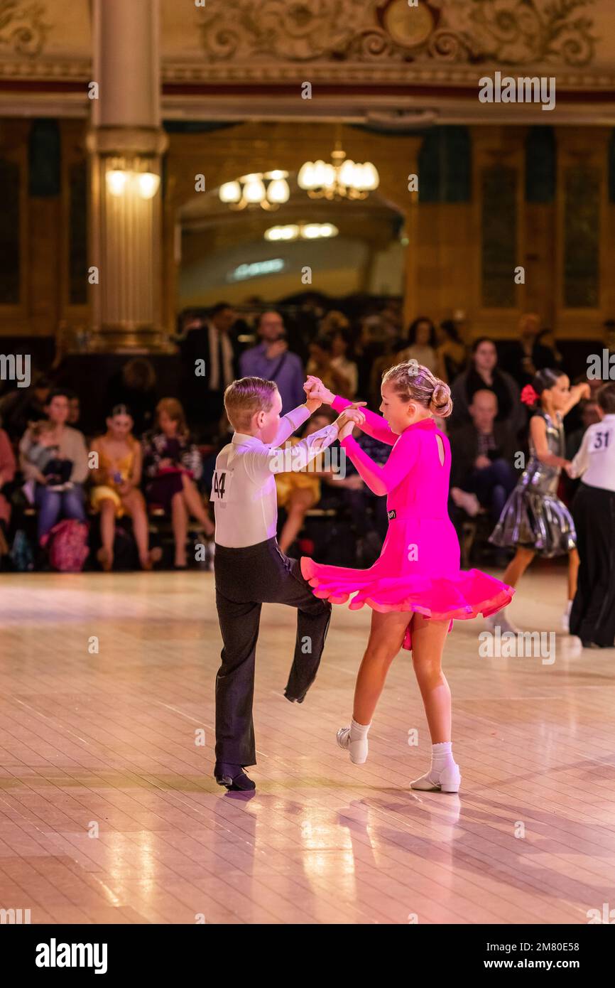 Attractive young couple of children dancing ballroom dance. Girl and ...