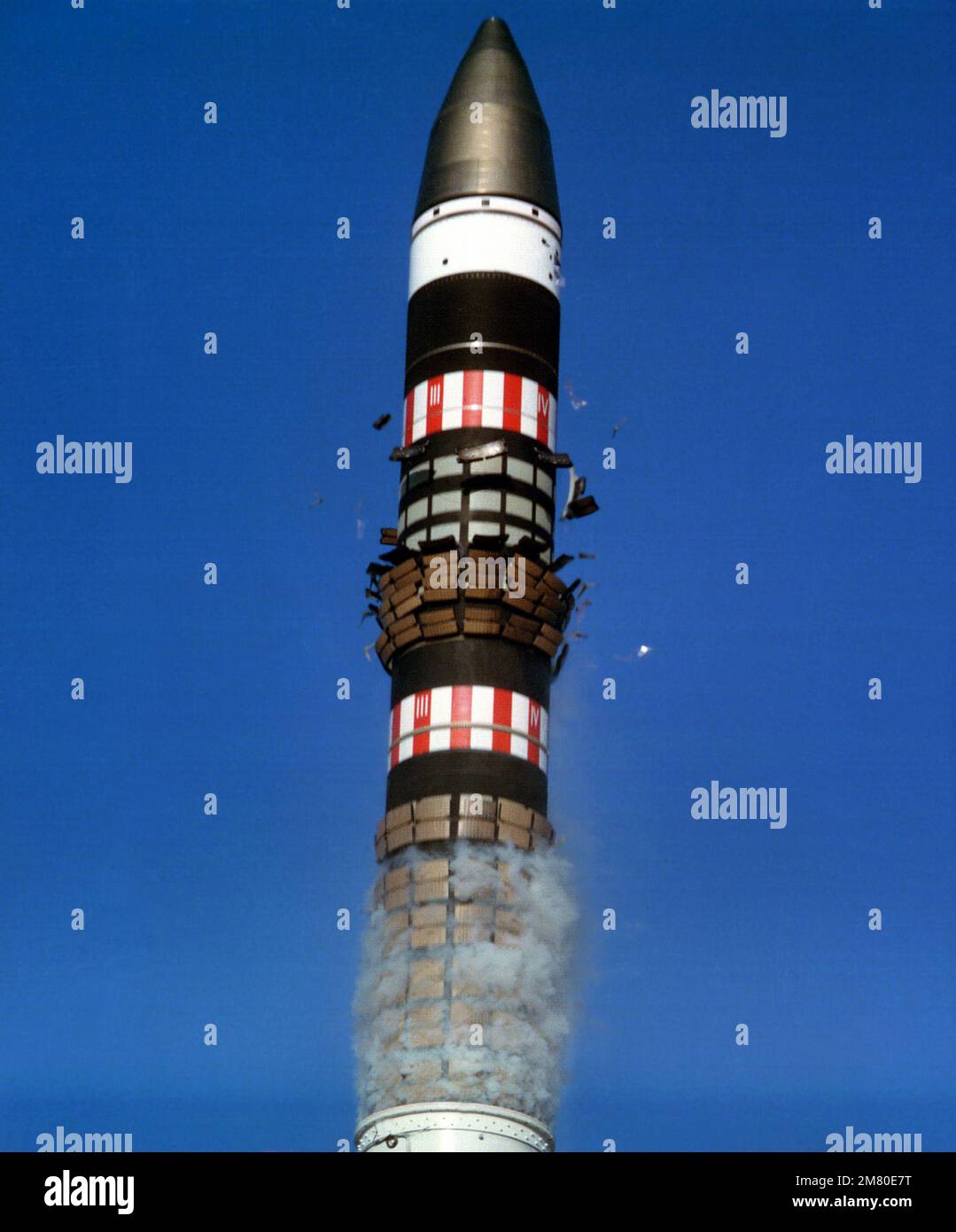 Shock-absorbing pads fall away from the surface of an MGM-118A ...