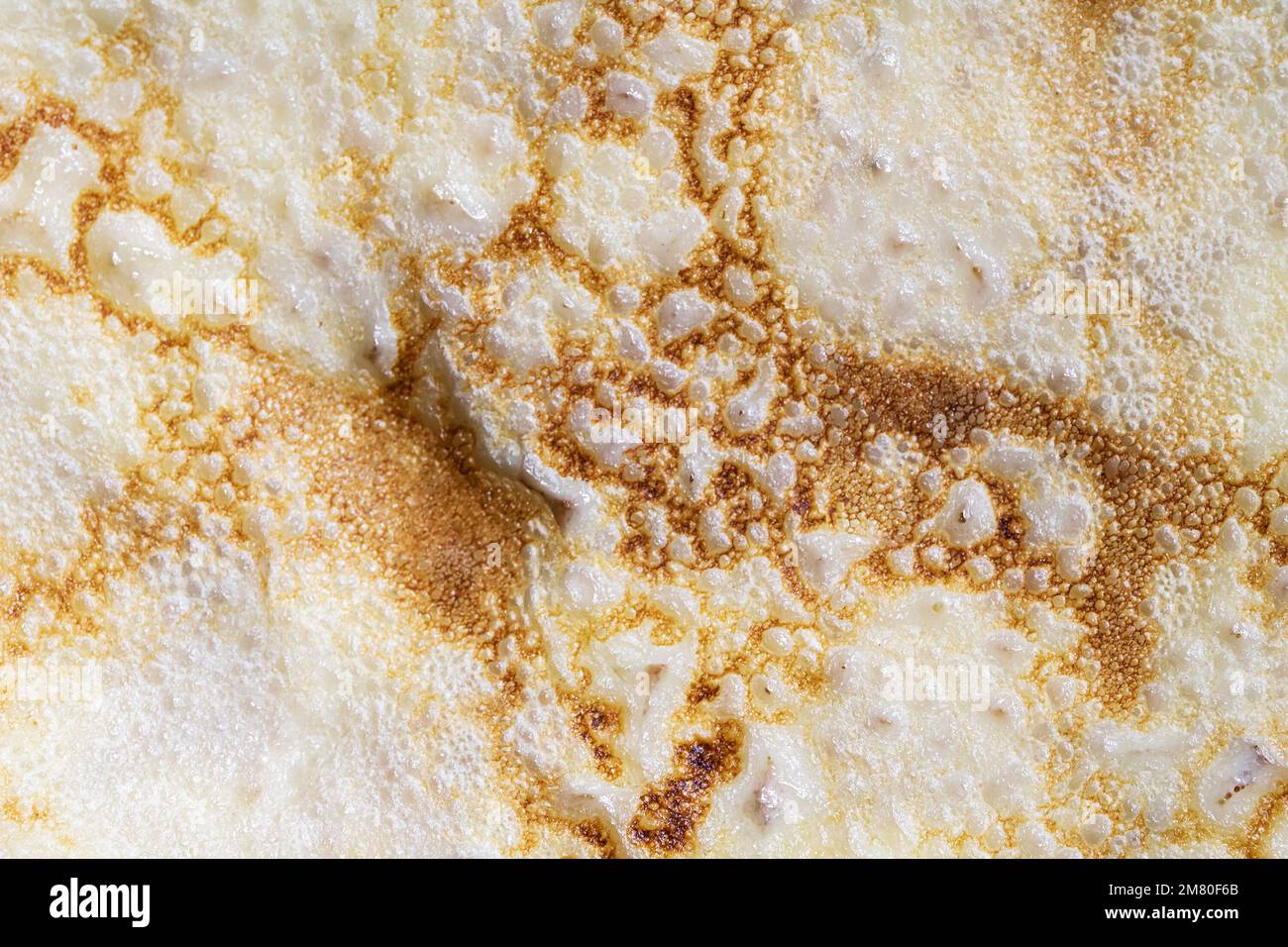 Pancake surface texture and pattern. Close-up of thin hot pancakes in a ...