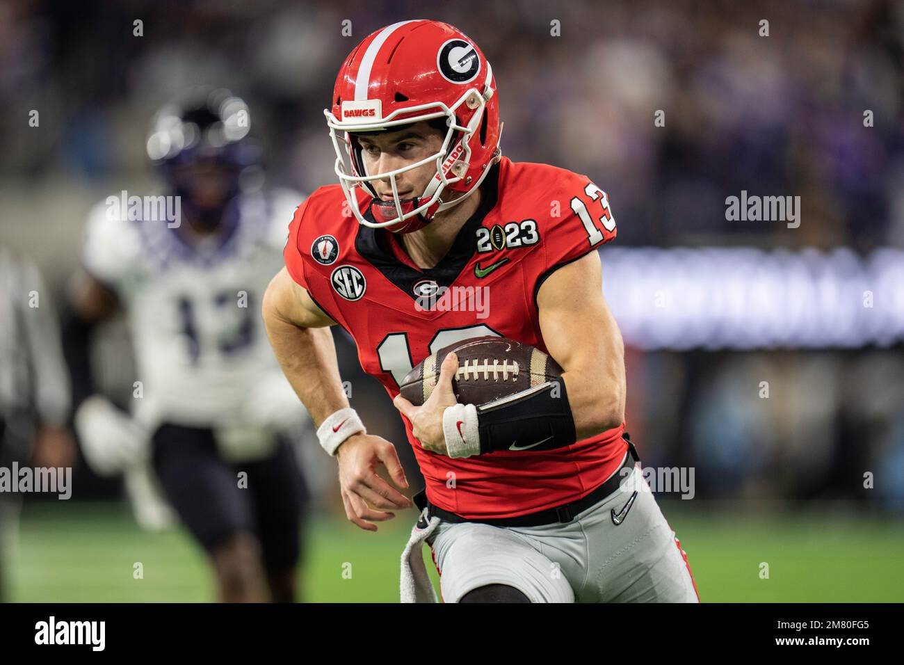 Georgia Bulldogs quarterback Stetson Bennett (13) runs the ball for a ...