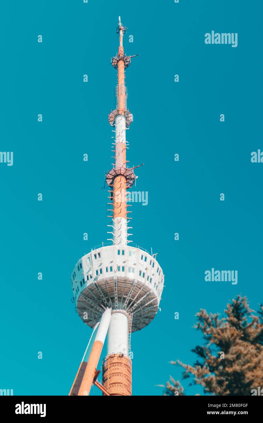 A vertical low-angle shot of the Tbilisi TV Broadcasting Tower against ...