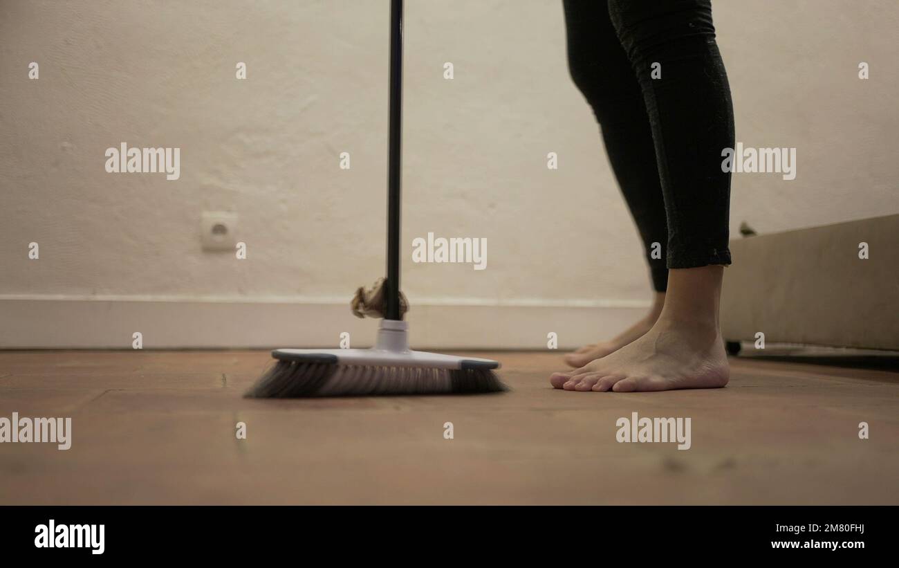 Person sweeping dusty floor hi-res stock photography and images - Alamy