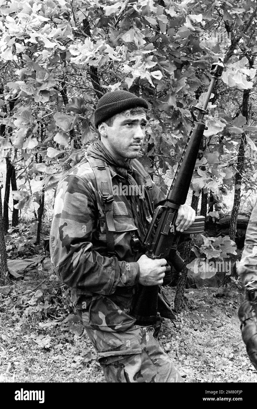 Security personnel stands on Black and White Stock Photos & Images - Alamy