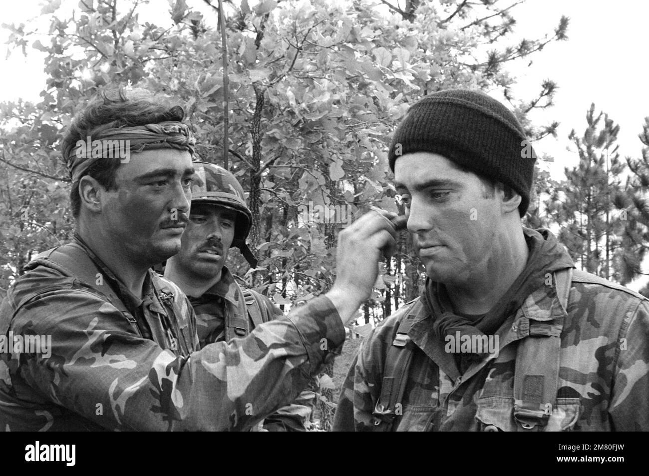 Security policemen demonstrate camouflage techniques during exercise ...