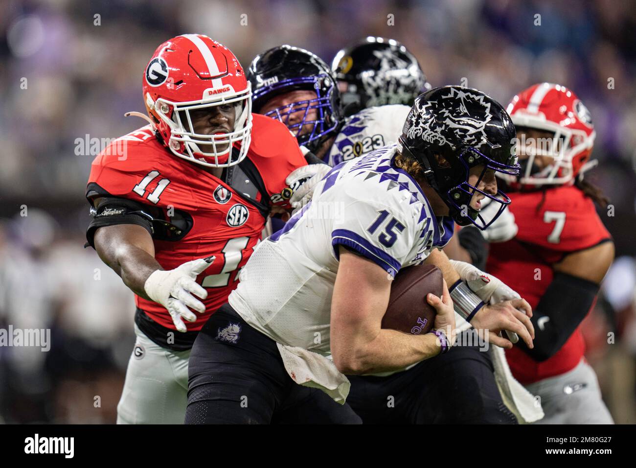 TCU Horned Frogs quarterback Max Duggan (15) tries to escape Georgia ...