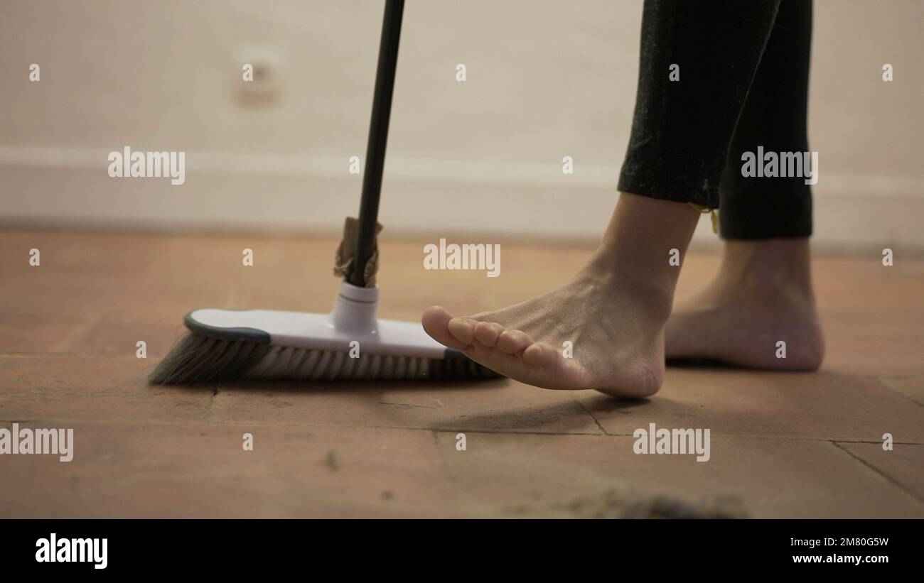 Person sweeping dirty floor doing hi-res stock photography and images ...