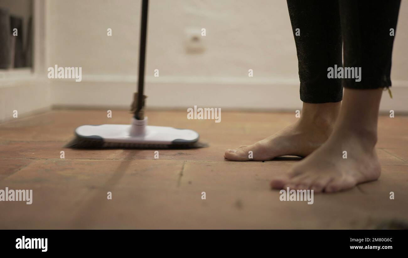 Person sweeping dirty floor doing hi-res stock photography and images ...