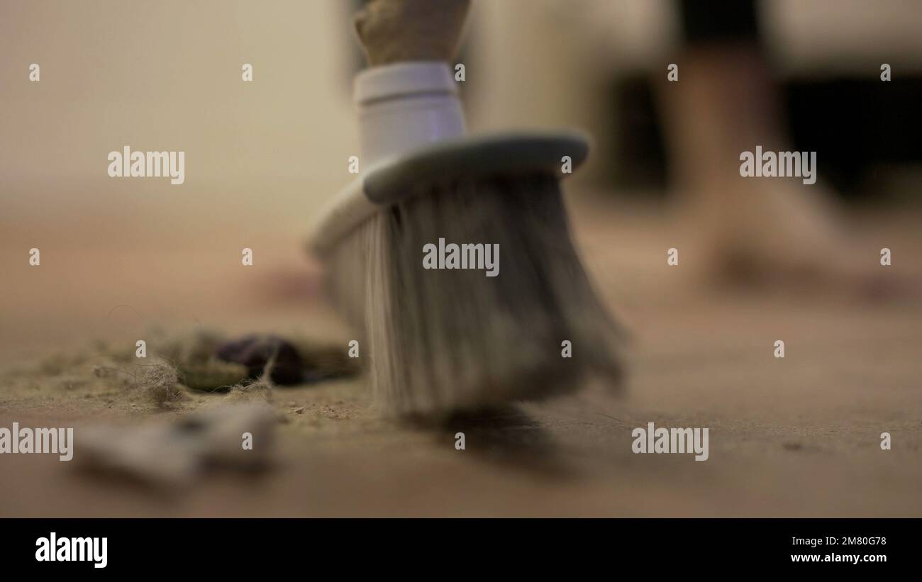Person sweeping dirty floor doing hi-res stock photography and images ...