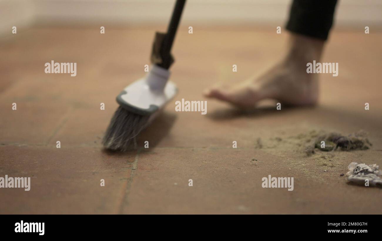 Person sweeping very dirty floor doing housework3 Stock Photo - Alamy