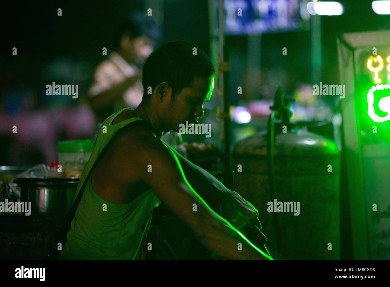 myanmar street food under a neon green light. Myanmar Stock Photo - Alamy