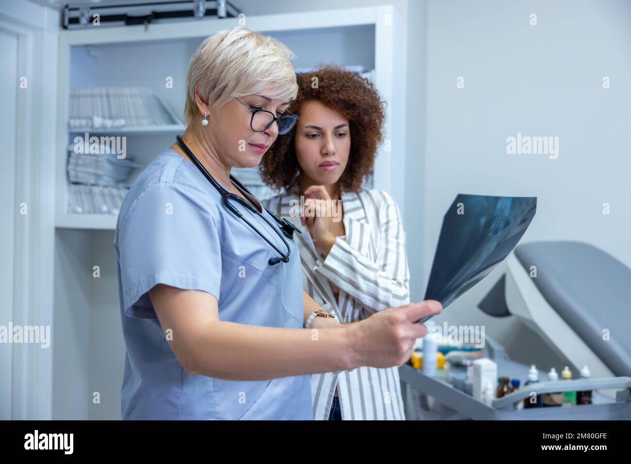 Young female doctor explaining results hi-res stock photography and ...