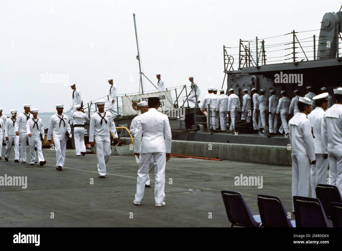 Crew members disembark from their ship for the last time at the ...