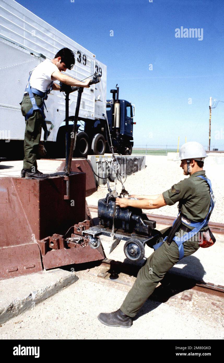 Members of the 44th Organizational Missile Maintenance Squadron move a ...